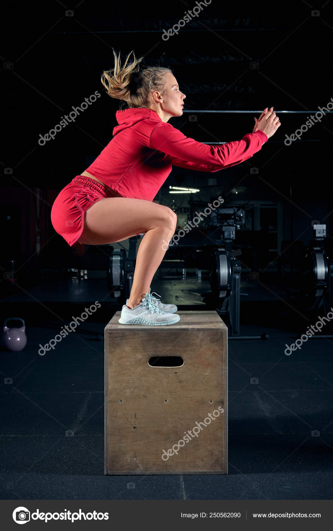 Female athlete is performing box jumps at gym. Stock Photo by ©nazarov ...