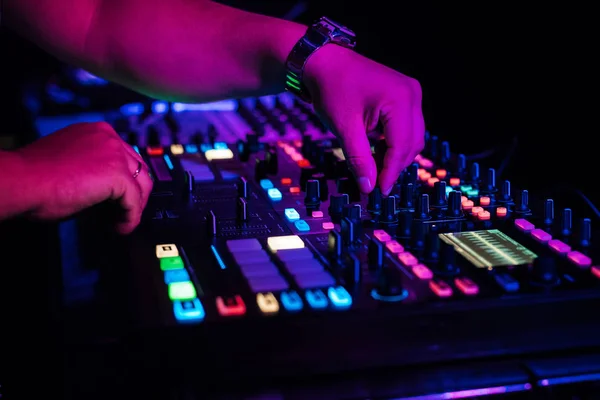 DJ plays electronic music in a nightclub at a party - Stock Image ...