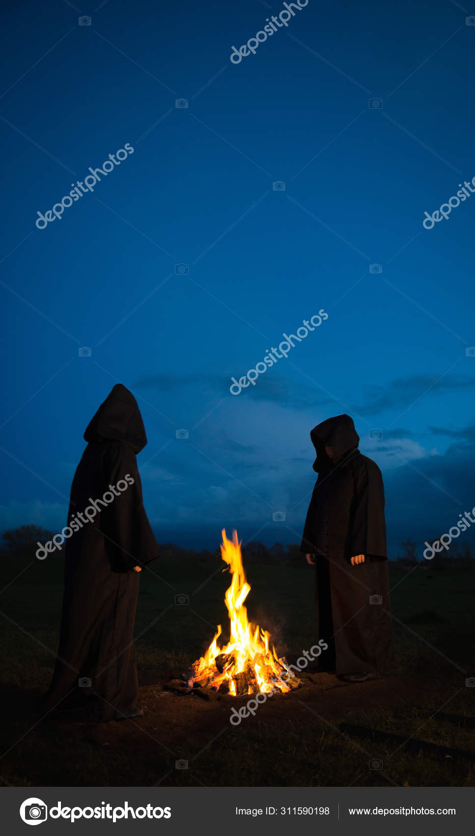 Pagans worshipping around a fire Stock Photo by ©teamjackson 311590198