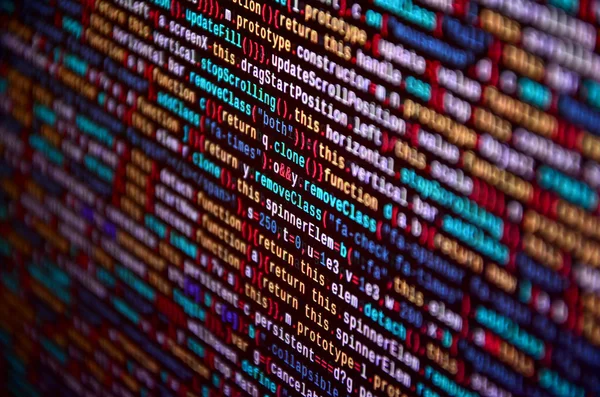 Software developer programming code on computer. Abstract computer script source code. Shallow ...