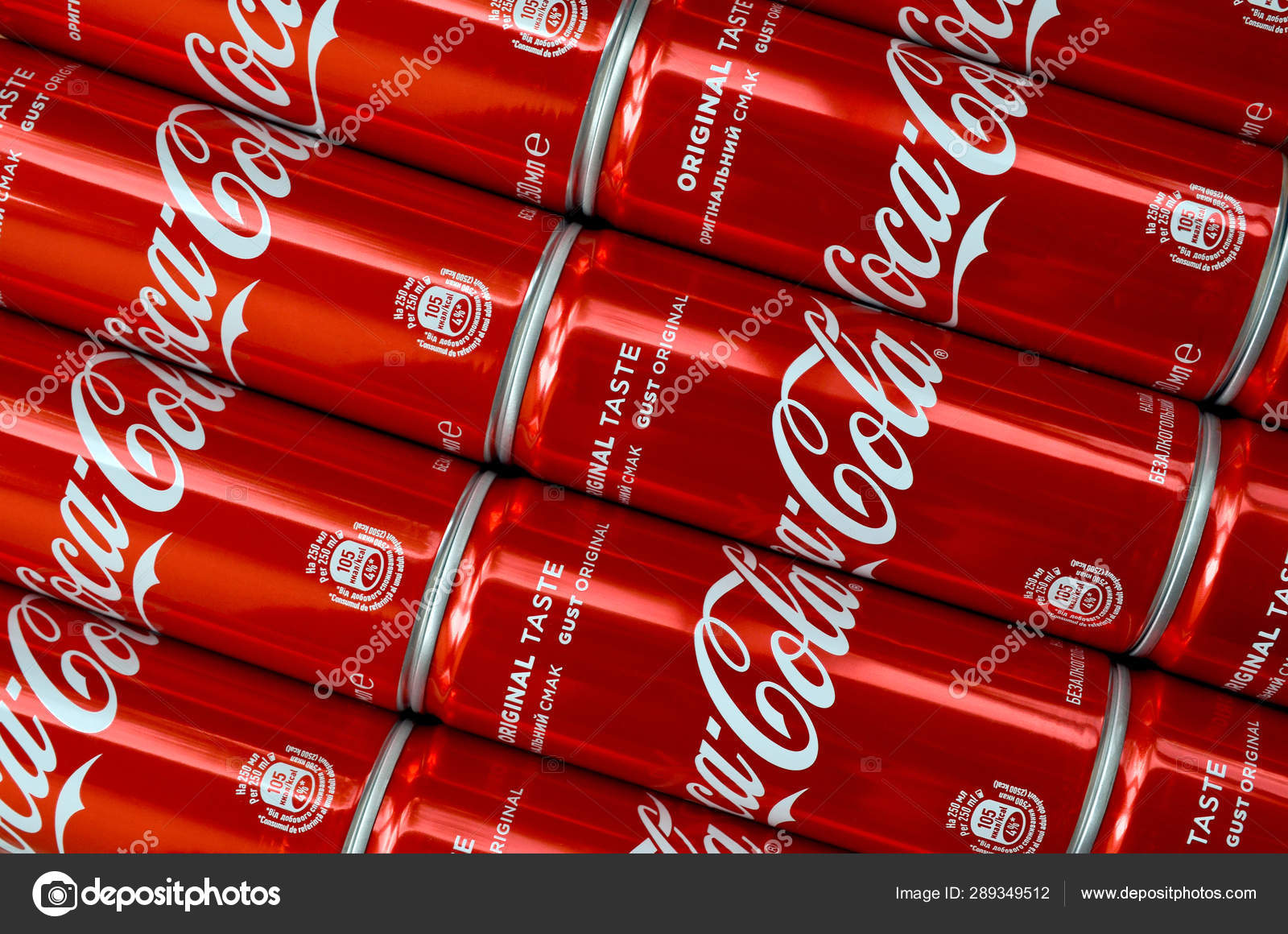 Coca-Cola logo printed on aluminium tin cans close up in shopping mall ...