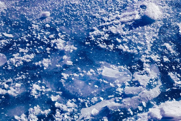 Blue ice texture. Abstract arctic winter background. Winter ice along ...
