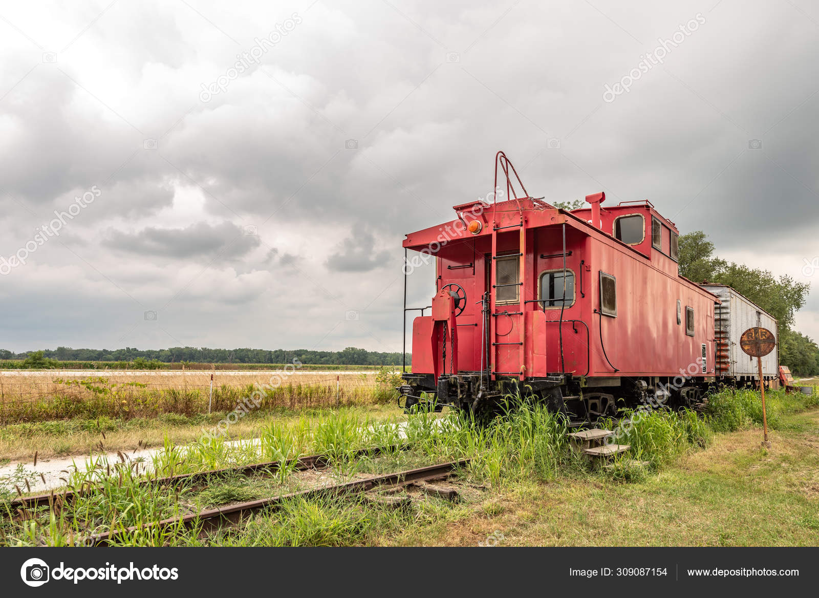 Red Caboose in Summer — Stock Photo © mtsue #309087154