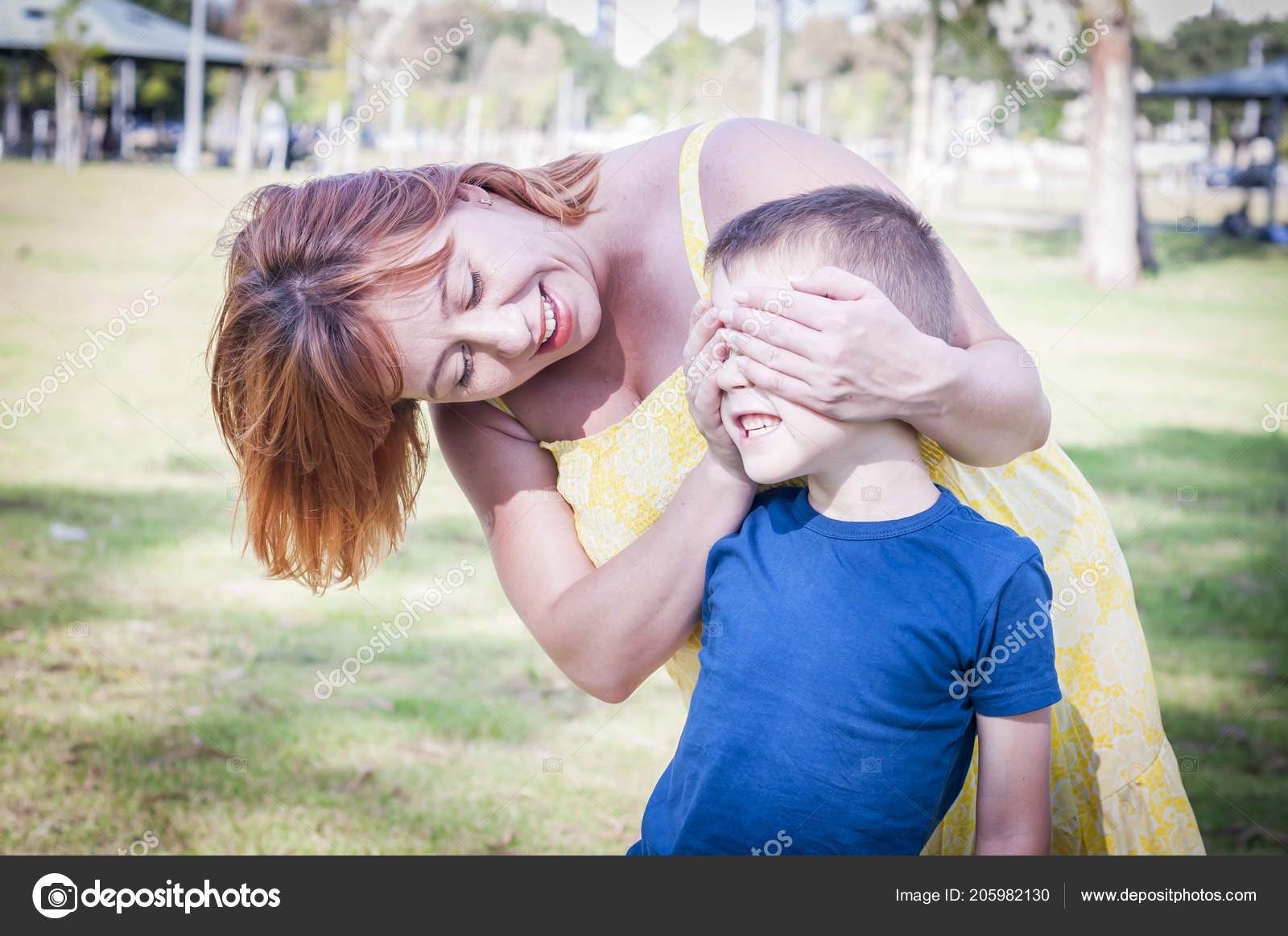 Young Caucasian Woman Closing Her Son's Eyes Standing Him Trying ...