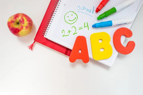 education in primary school. a layout of ABC letters, a notebook and ...