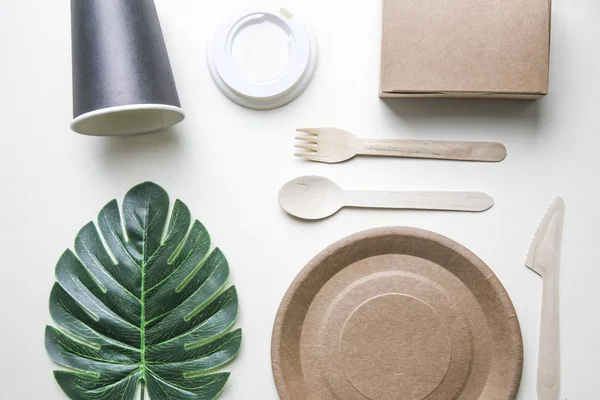 Eco friendly disposable dishes made paper on white marble background ...