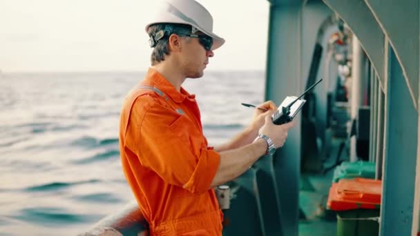 Chief officer on deck of ship or vessel with checklist — Stock Video ...