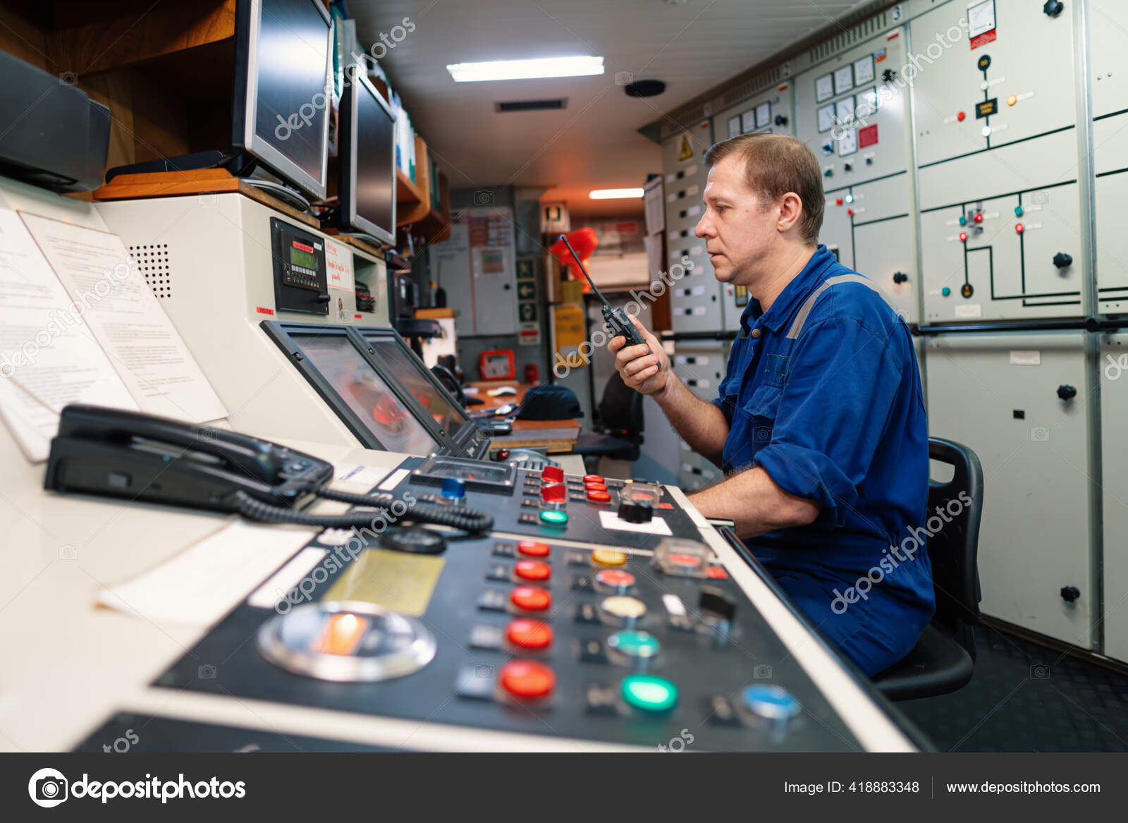 Marine engineer officer controlling vessel engines and propulsion in ...