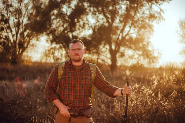 Irish looking red bearded hunter in checkered shirt staying outdoors in ...