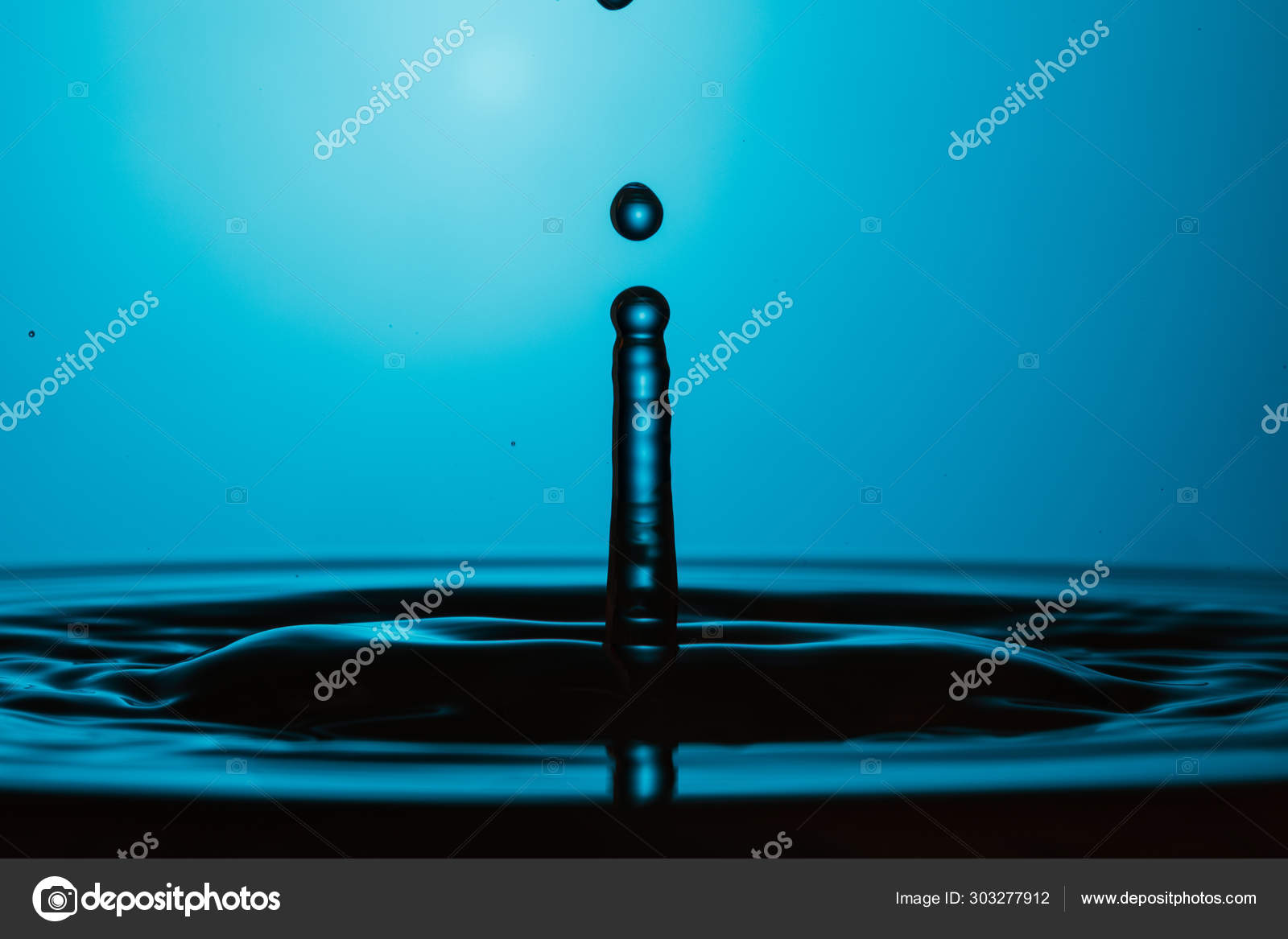 Drop of water falling down in the water — Stock Photo © gorov108 #303277912