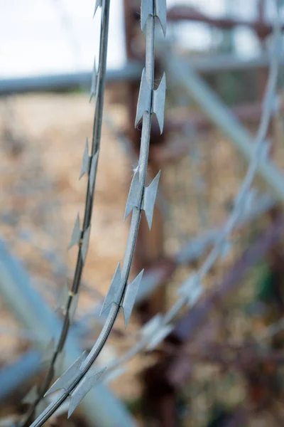 Barbed wire fence details Stock Photos, Royalty Free Barbed wire fence ...
