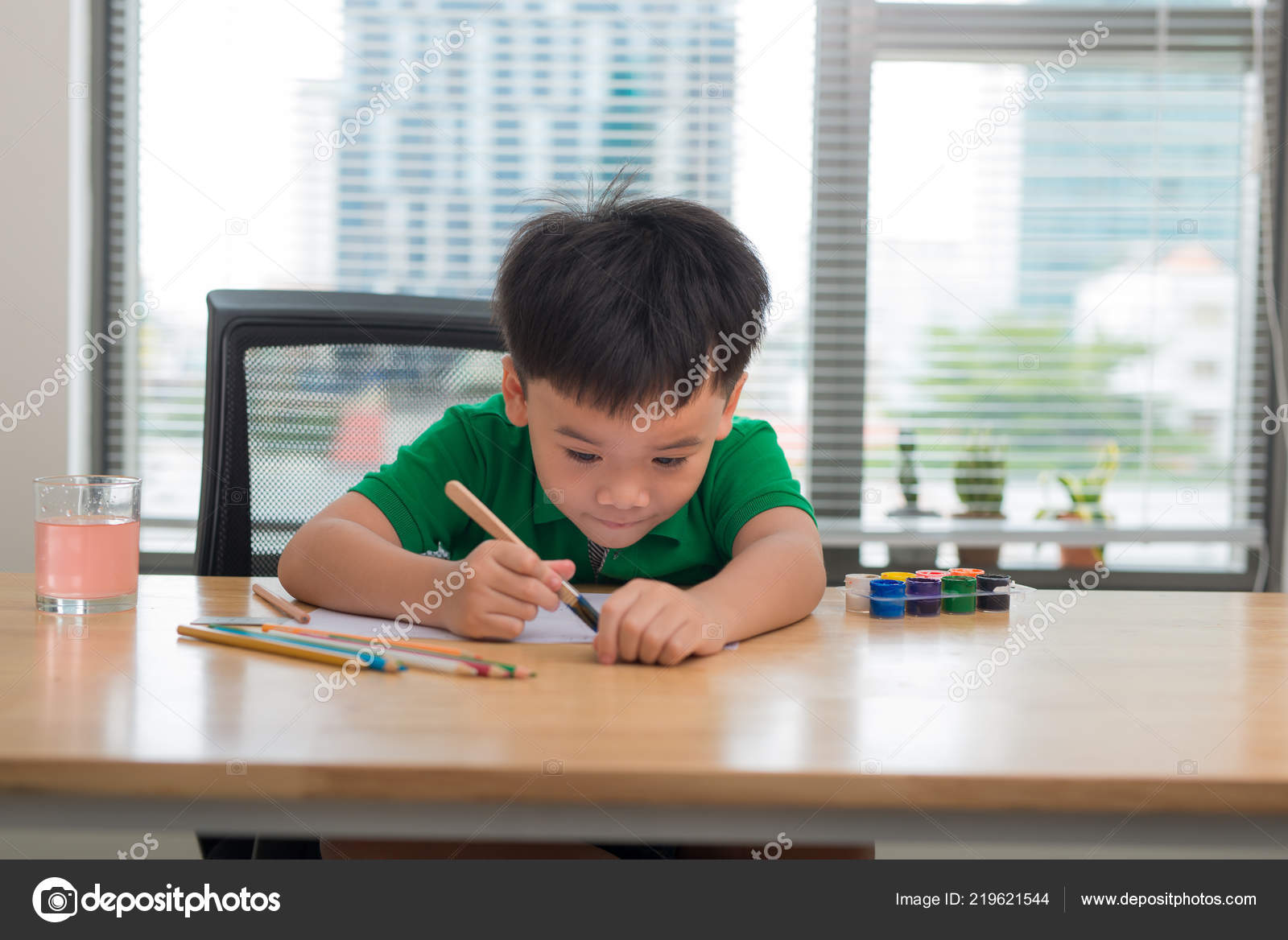 Cute Smiling Asian Boy Doing Homework While Sitting Desk Education ...