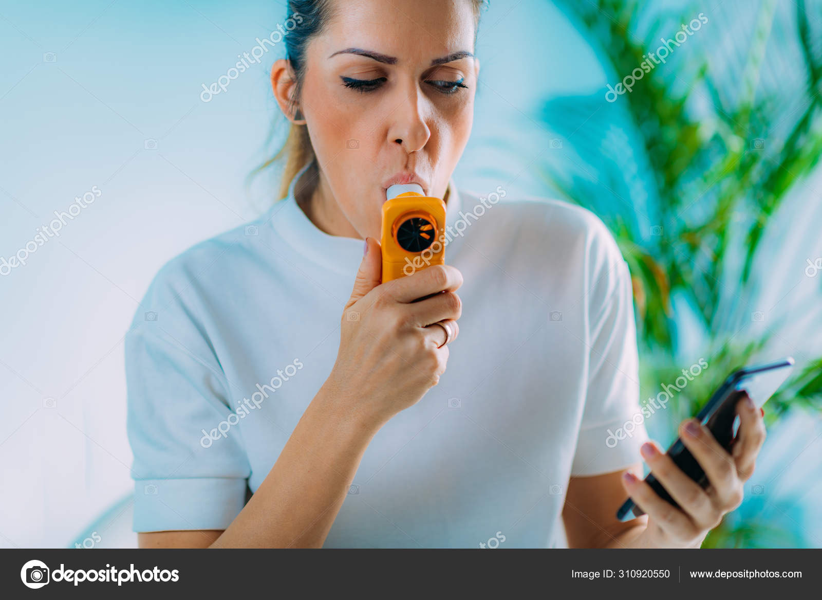 Woman Using Portable Spirometer Smart Phone App Stock Photo by ...