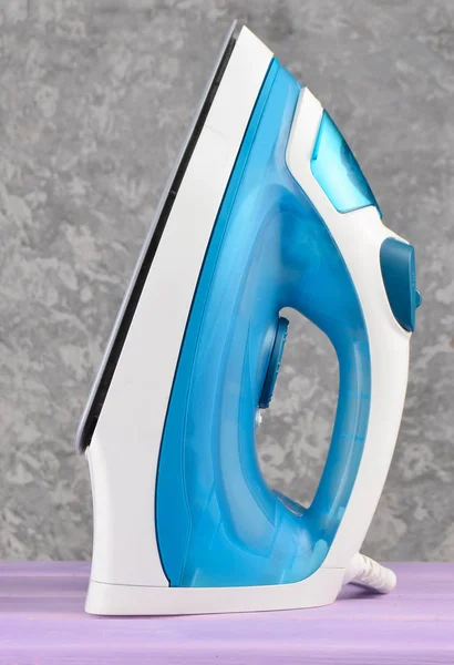 Iron for ironing on a concrete background, minimalist tren - Stock ...