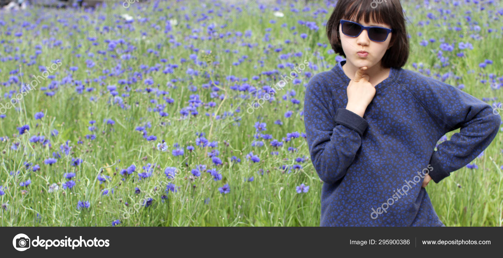 Inspired child with sunglasses determined over a natural impressionist ...