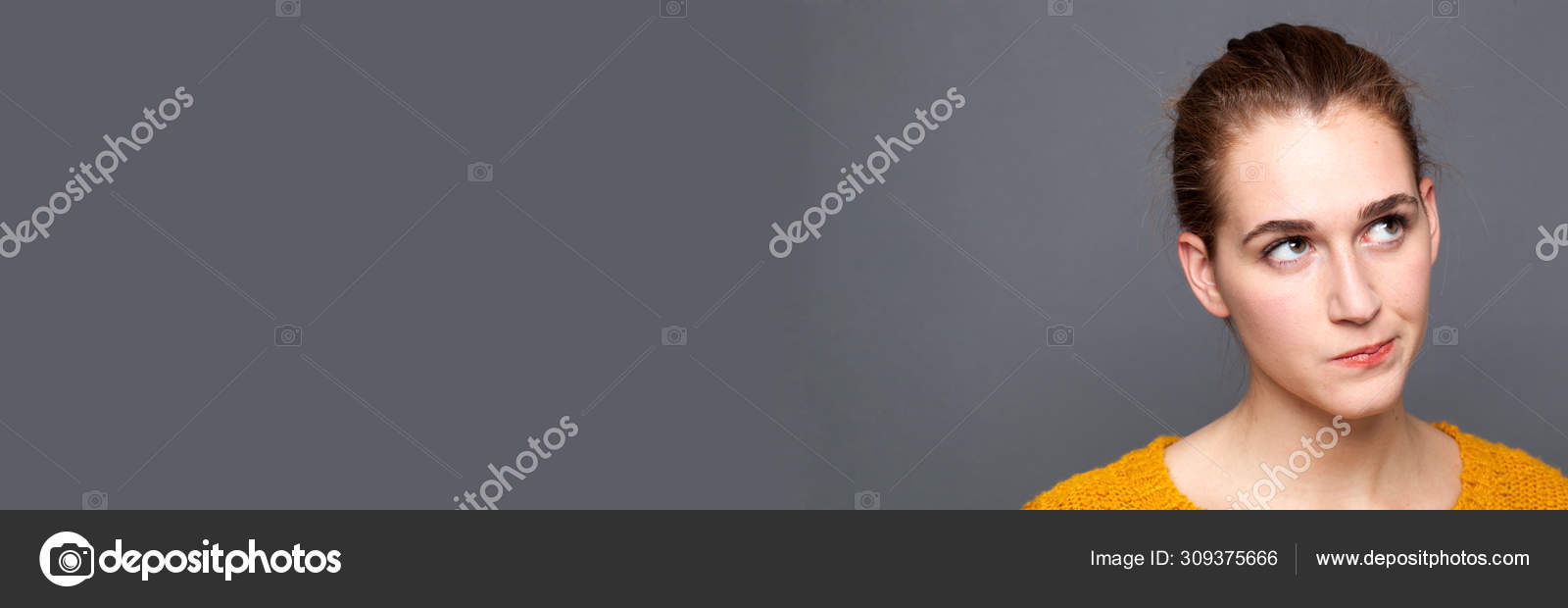 Confused beautiful girl looking up, searching for idea, solution ...