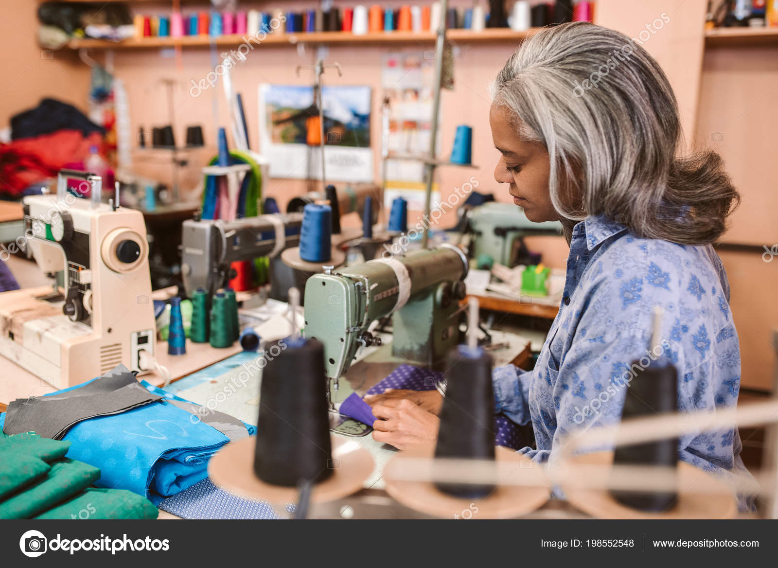 Mature Seamstress Sitting Sewing Machine Stitching Piece Colorful ...
