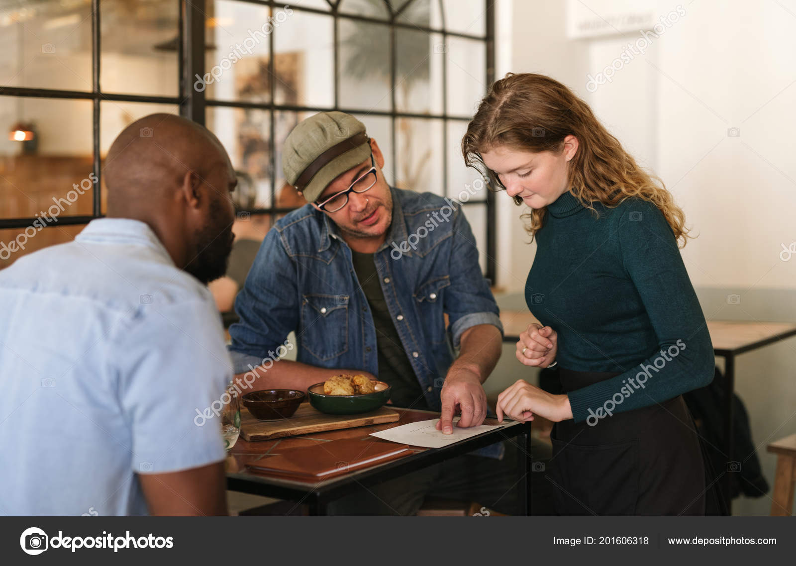 Smiling Young Waitress Answering Menu Questions Two Customers Sitting ...