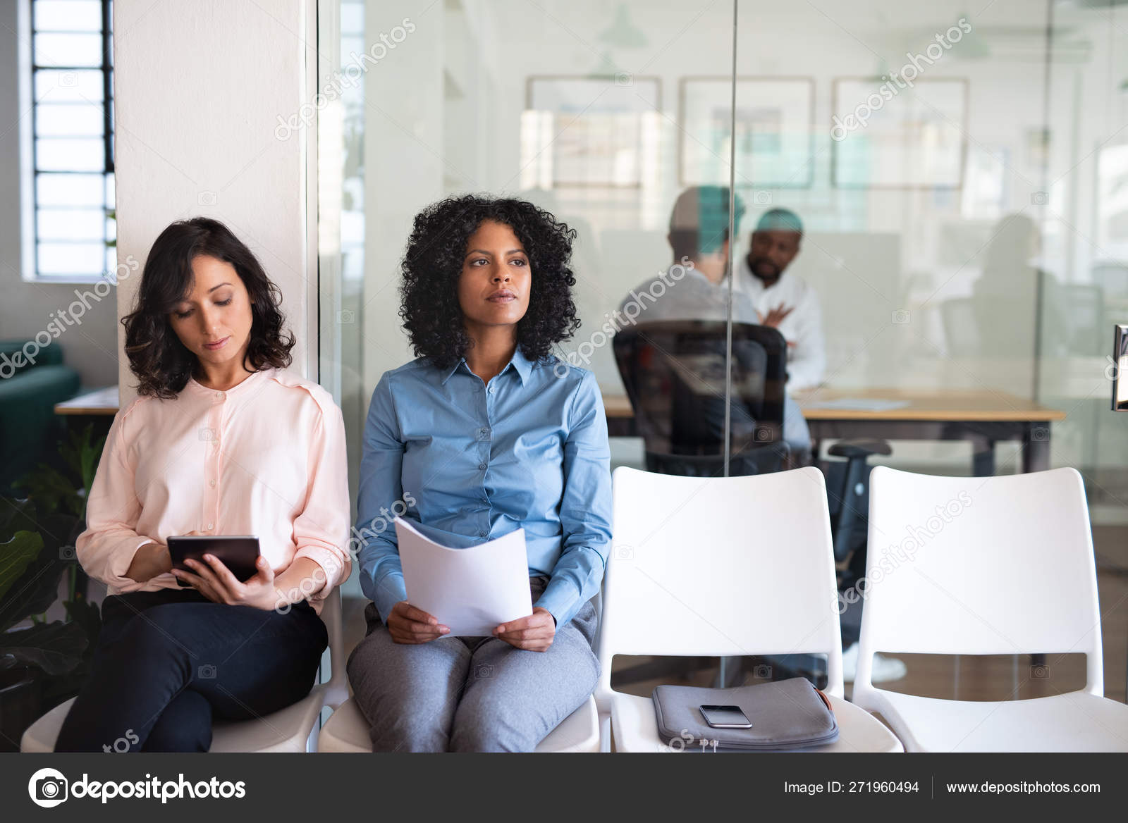 Two Female Job Applicants Sitting Chairs Together Office Preparing ...