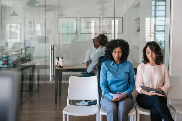 Two Female Job Applicants Sitting Chairs Together Office Preparing ...