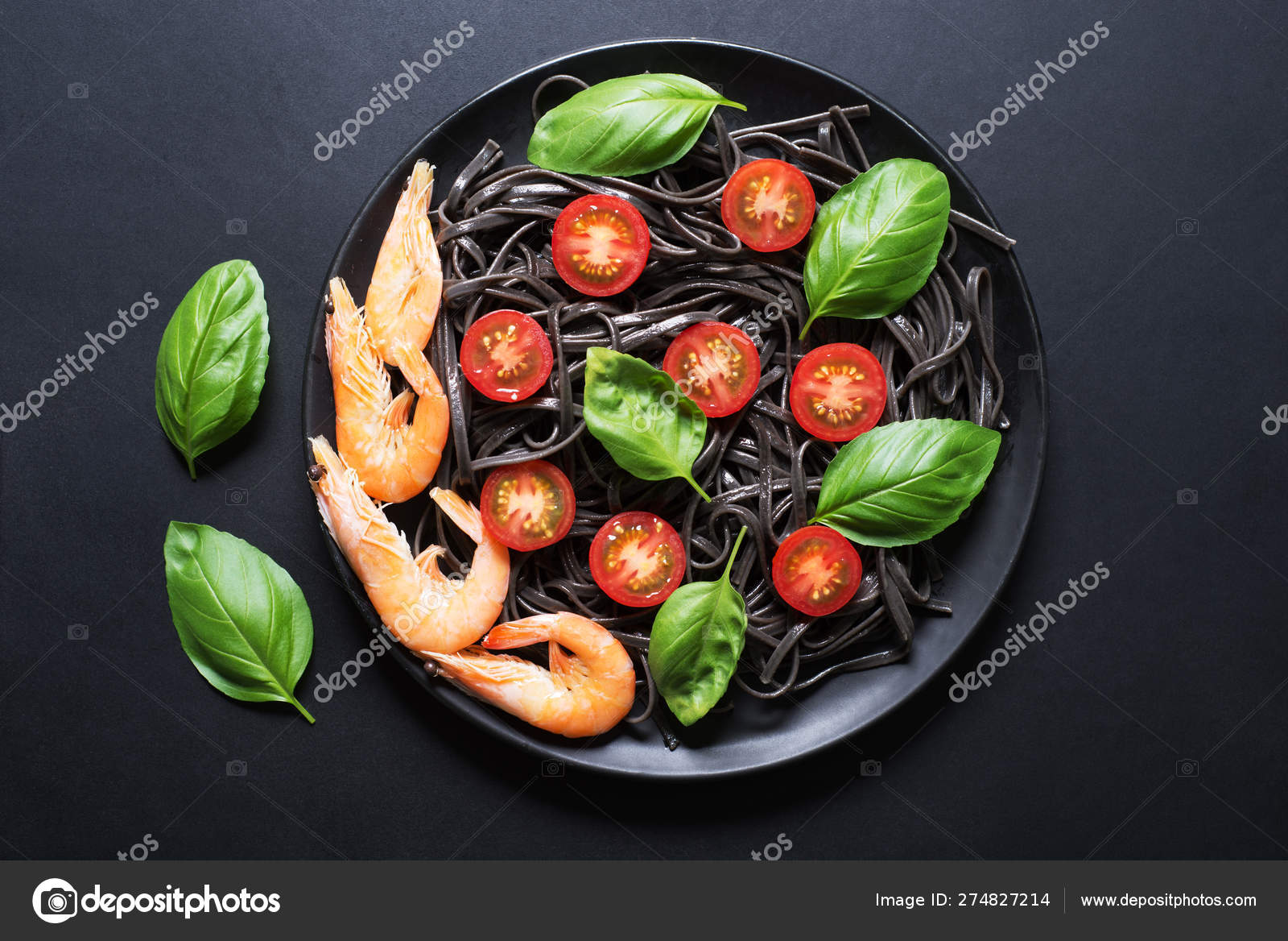 Black pasta (with black cuttlefish ink), cherry tomatoes, shrimp ...