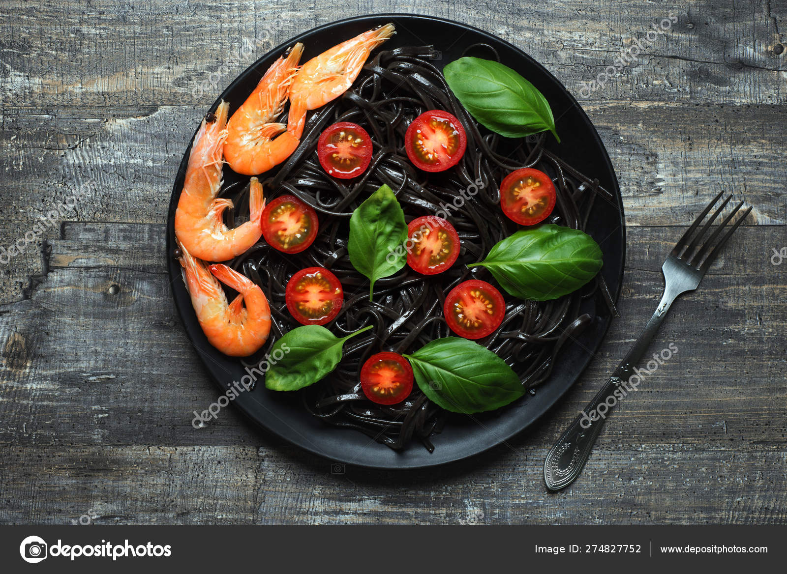 Black pasta (with black cuttlefish ink), cherry tomatoes, shrimp ...