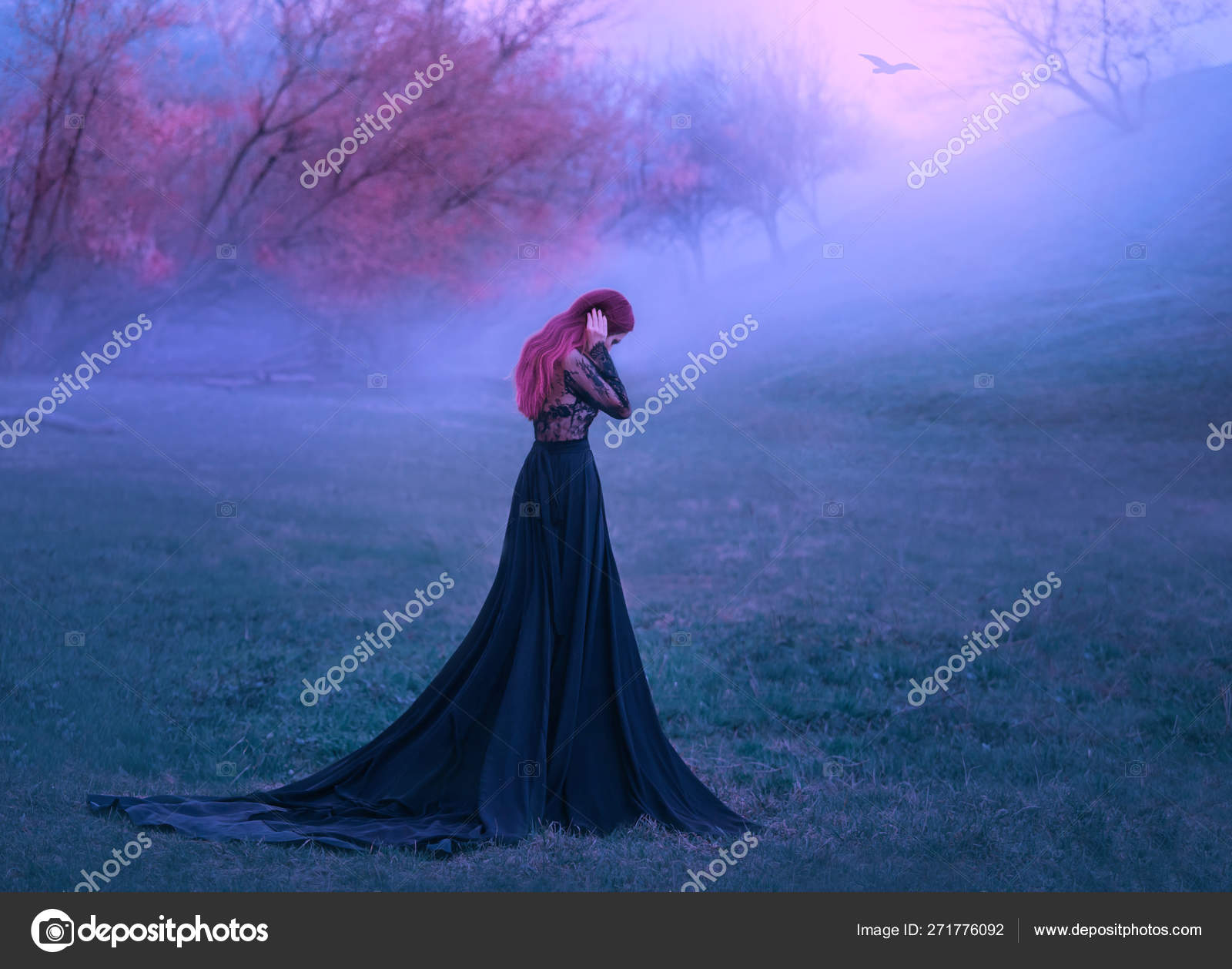 A sad lady in a black dress unhappy wanders in the fog. Background of ...
