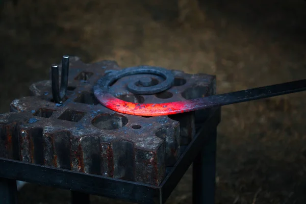 A hot metal rod being hammered on an anvil by a Blacksmith. - Stock ...