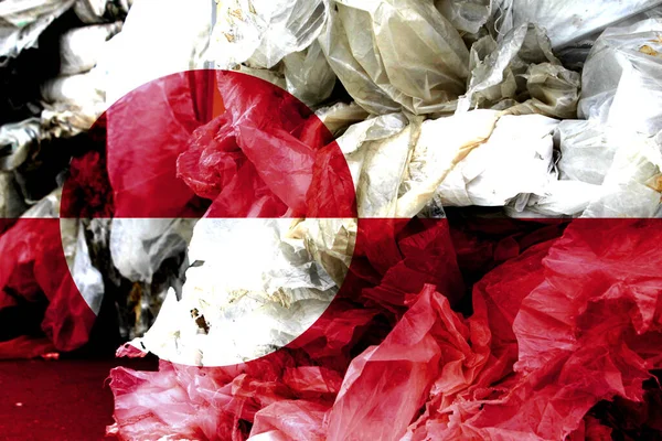 The flag Greenland is shown on the trash bag. Ecology concept with ...