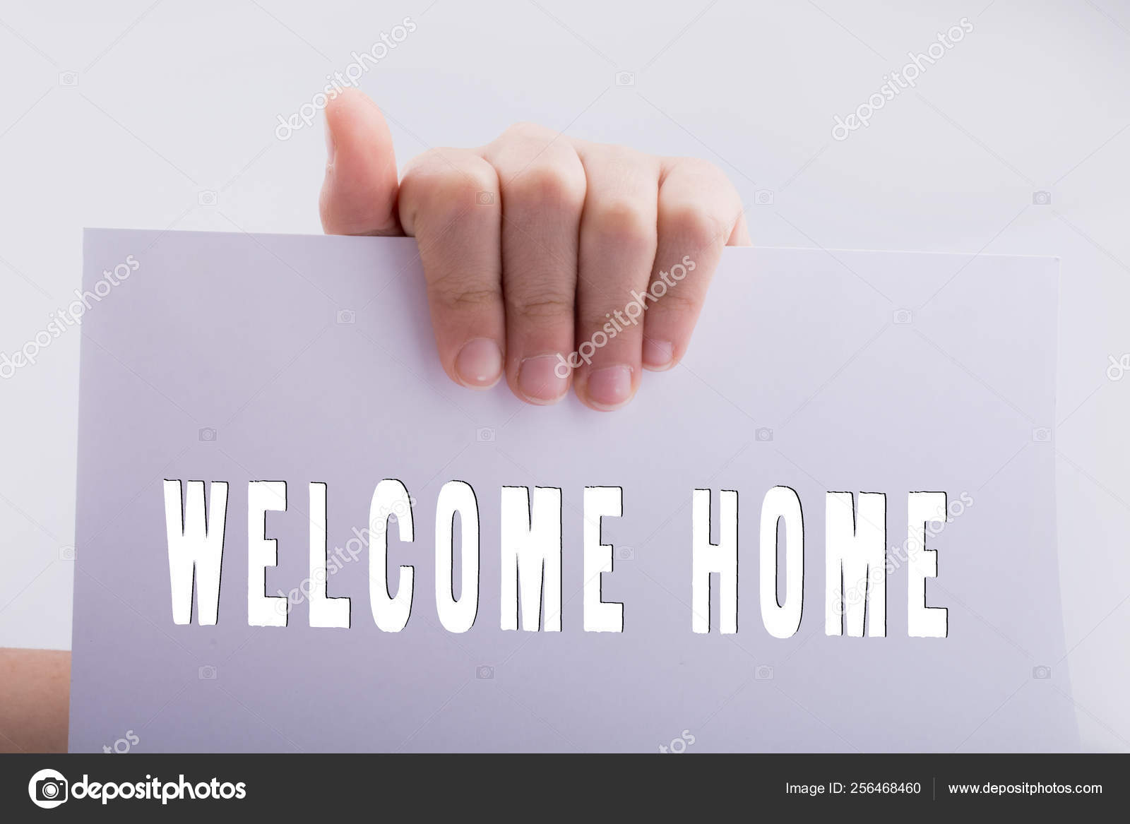Hand holding paper with welcome wording — Stock Photo © turgayada ...