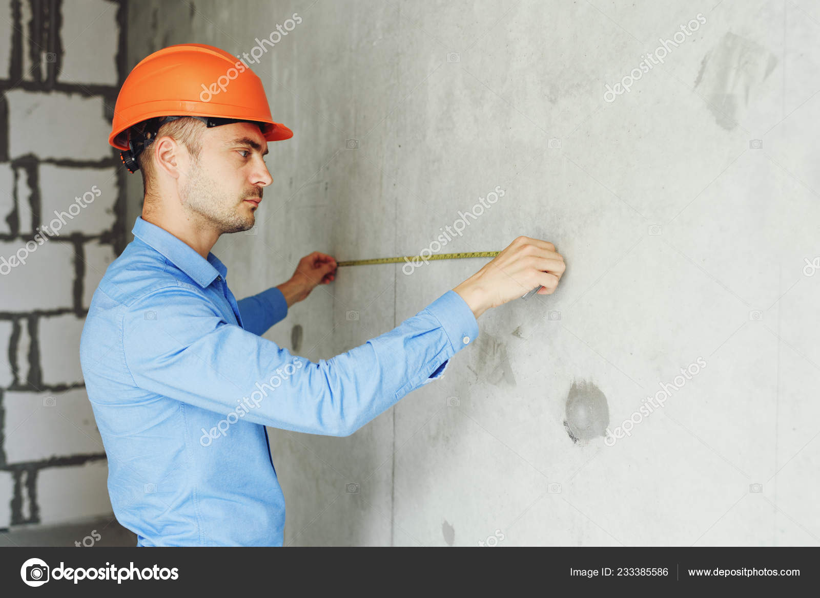 Satisfied Construction Worker Foreman Measures Tape Measure Wall ...