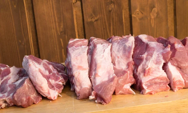 Raw fat cuting pieces of pork on wooden background. Piece of fresh ...