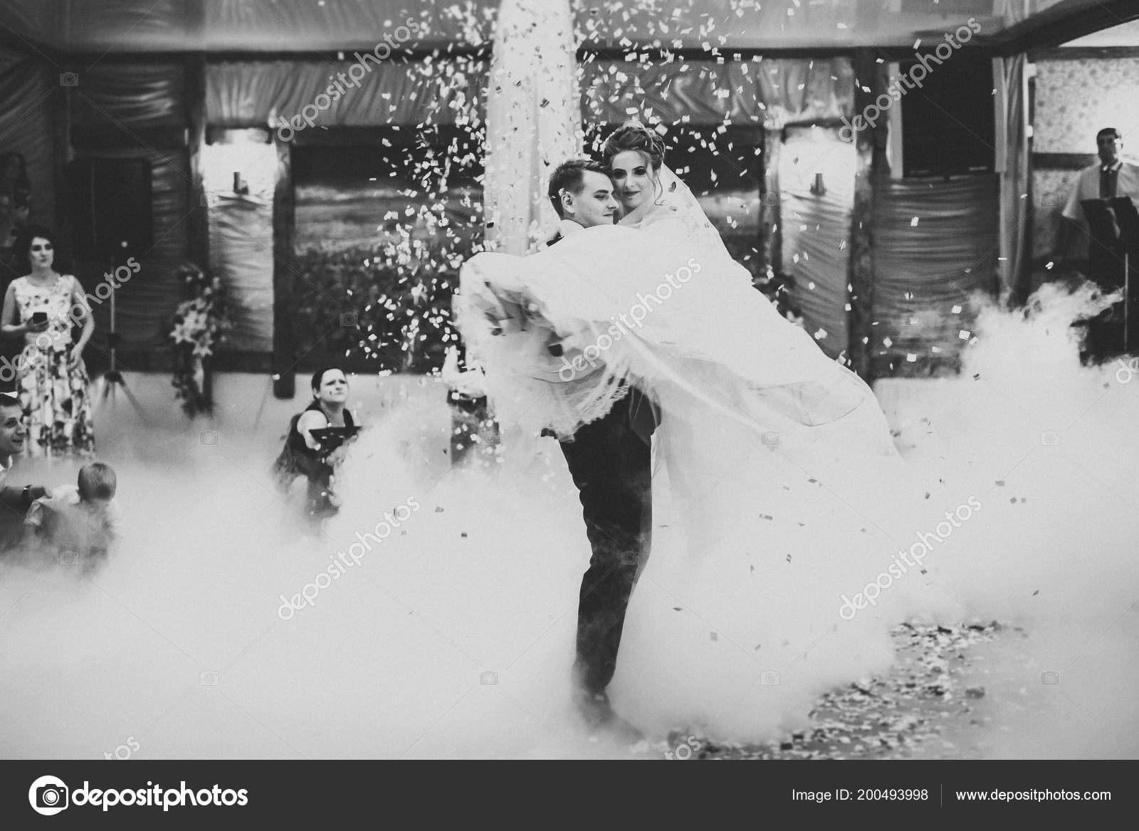 Beautiful caucasian wedding couple just married and dancing their first ...