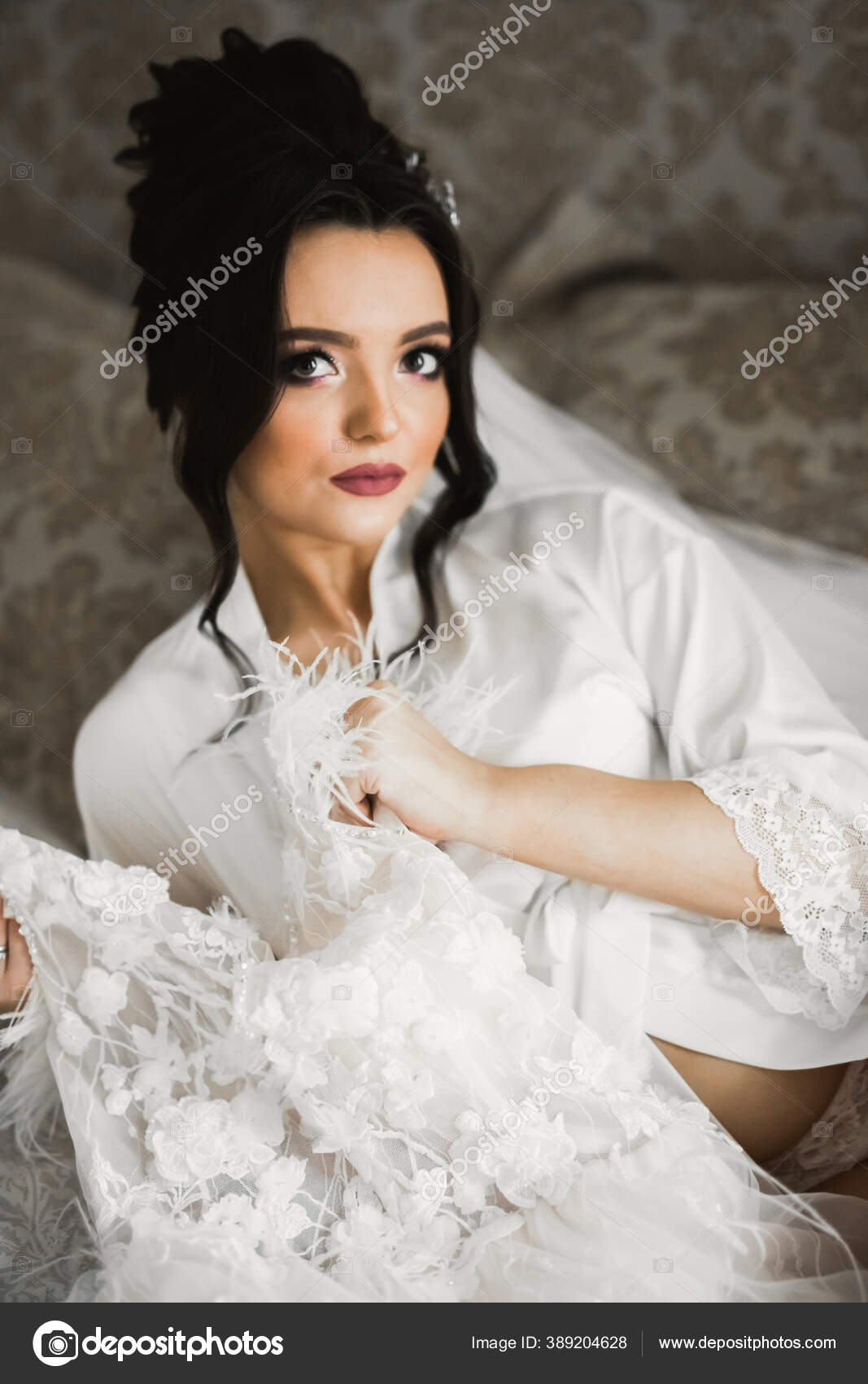 Beautiful bride wearing fashion wedding dress with feathers with luxury ...