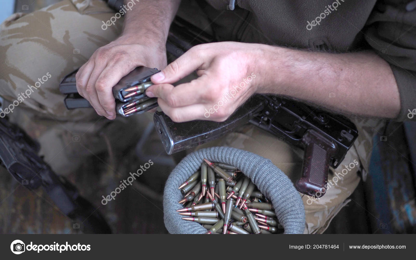 Soldier loading a bunch of bullets into a handgun magazine. — Stock ...
