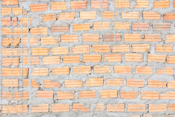 Clutching a brick wall panel is made up by bricks and mortar, concrete ...
