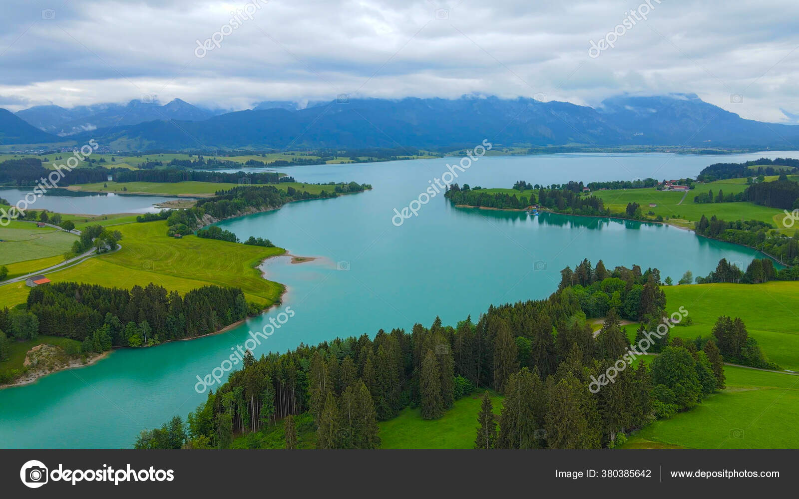 Aerial view over Lake Forggensee at the city of Fuessen in Germany ...