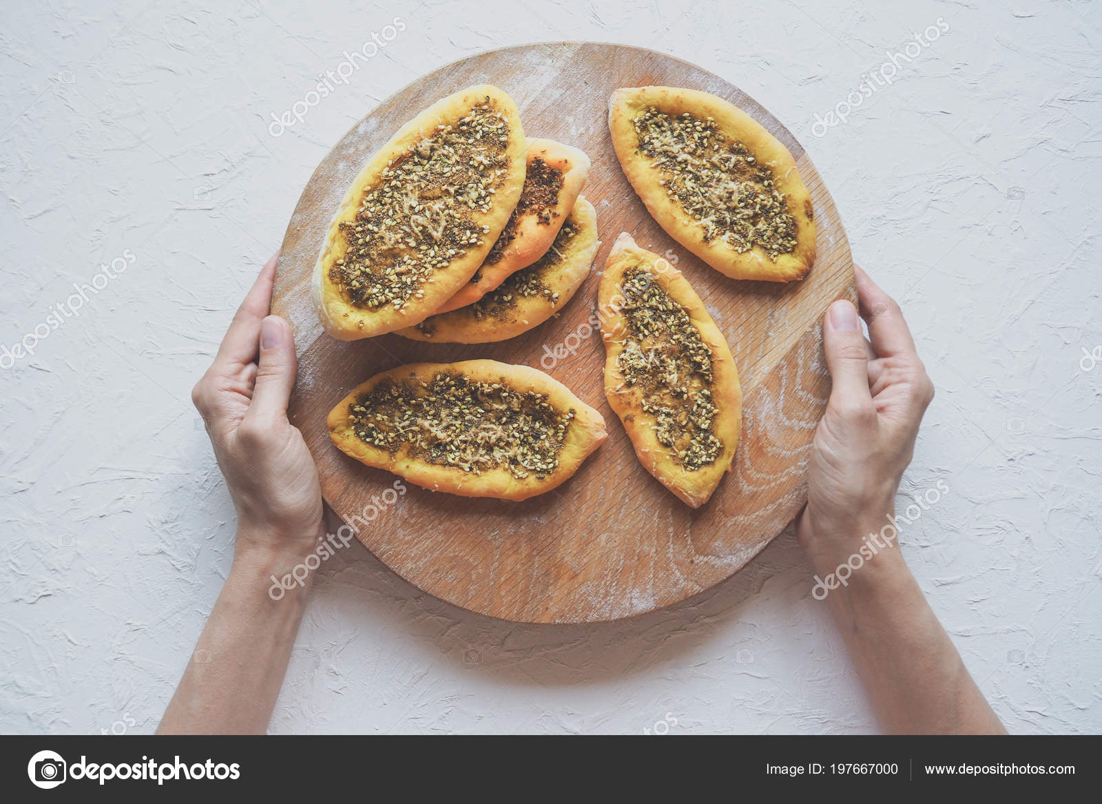 Scones with zatar. Manakish Arabic on a wooden tray. Arabic cuisine ...