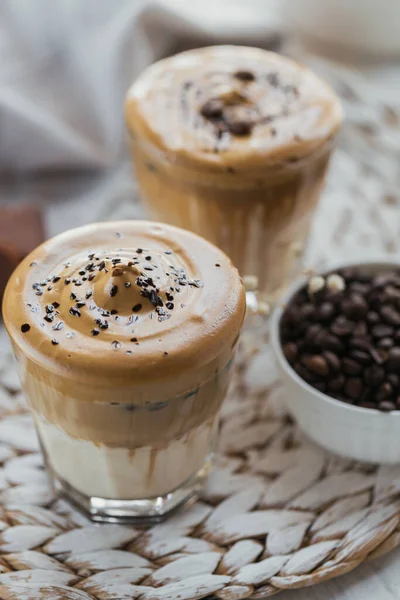 Glass of Iced Dalgona Coffee, a trendy fluffy creamy whipped coffee and ...