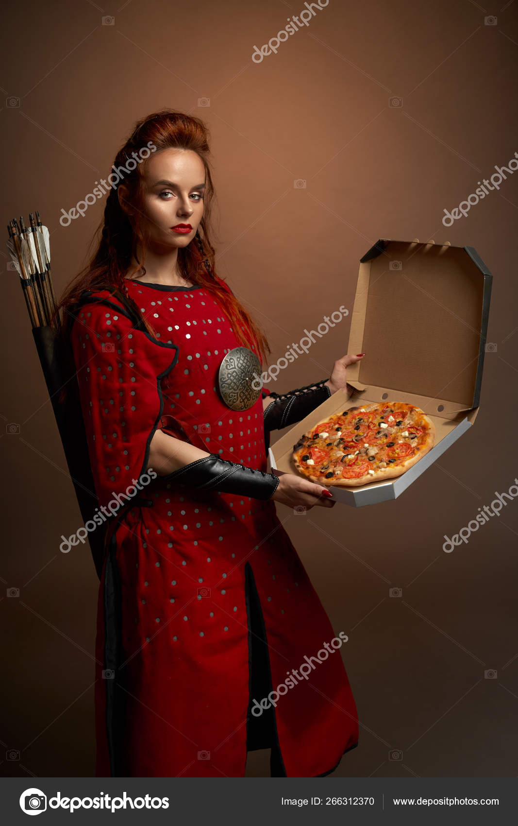 Female fighter in armor keeping pizza on isolated background Stock ...