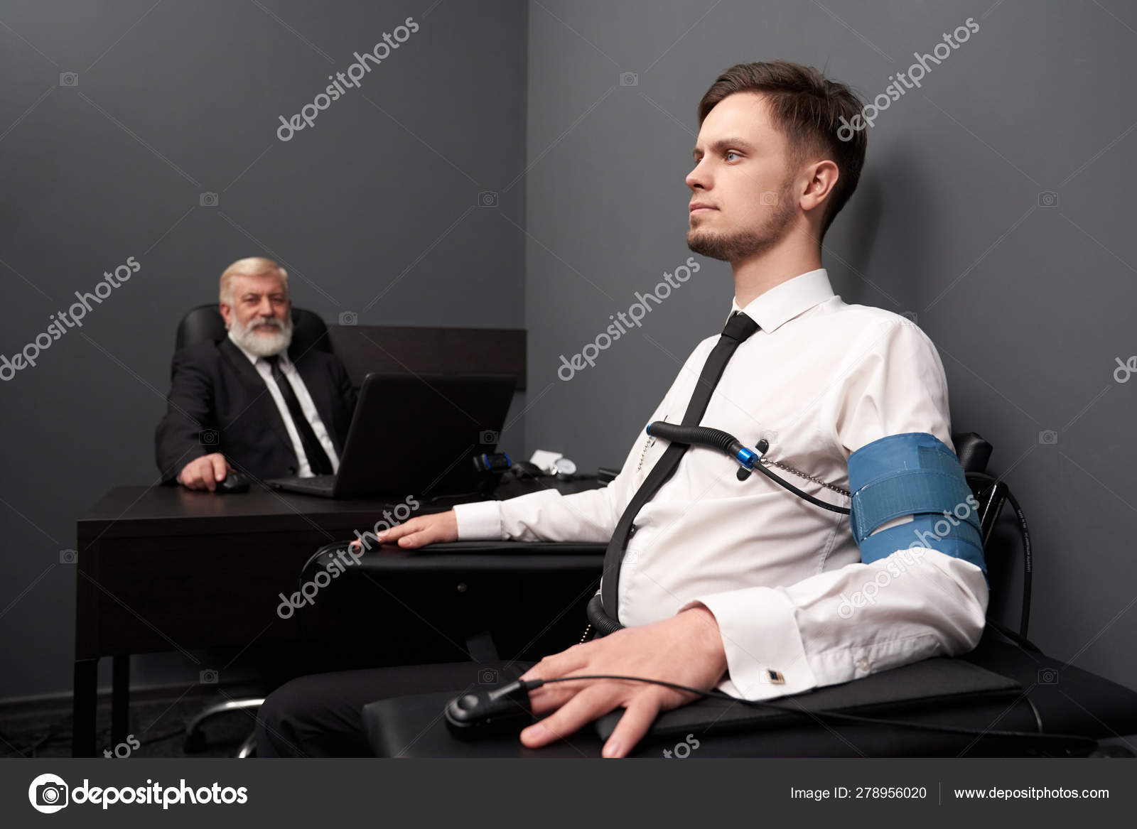 Serious man telling truth during lie test on detector Stock Photo by ...