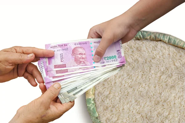 Indian cash money changing hands between a buyer and farmer Stock Photo ...