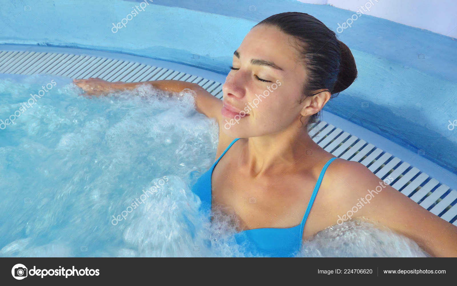 Beautiful Young Girl Woman Relaxed Hydromassage Bath Blue Bathing Suit