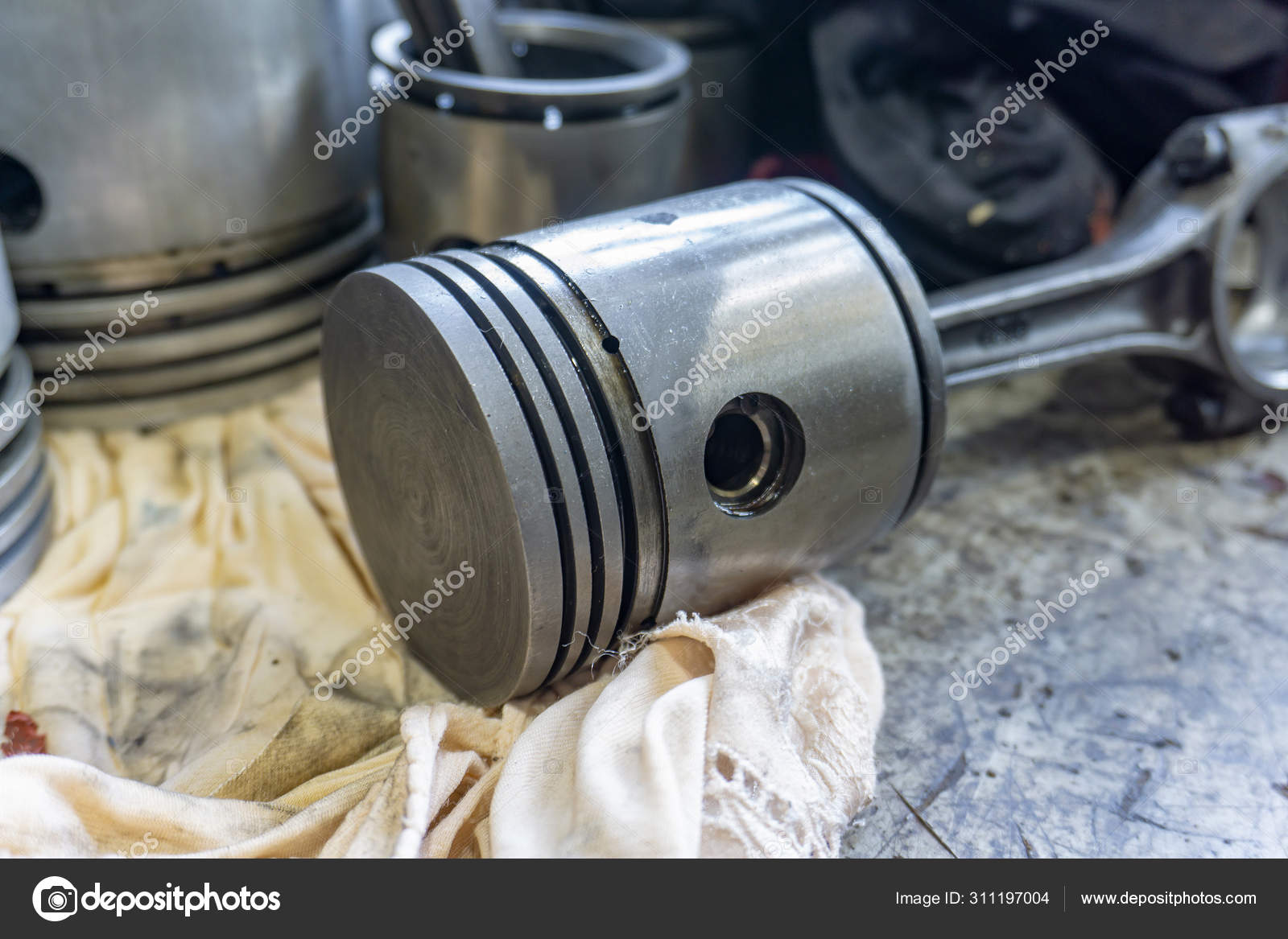 The connecting rod, piston and cylinder block in a disassembled ...