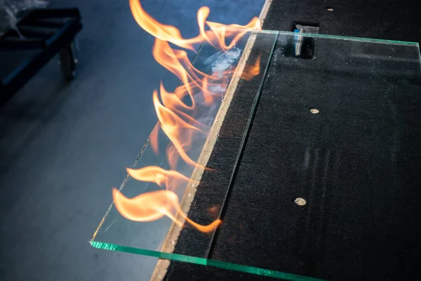 Burning glass. Professional cutting of safety glass called VSG (Very ...