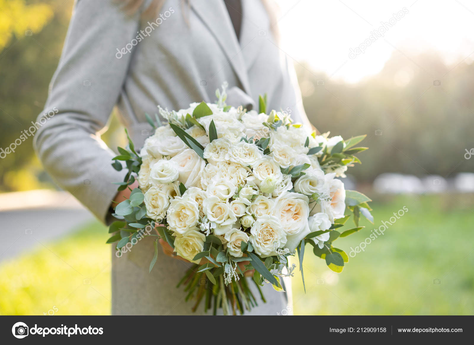 Young girl holding a beautiful spring bouquet. flower arrangement with ...