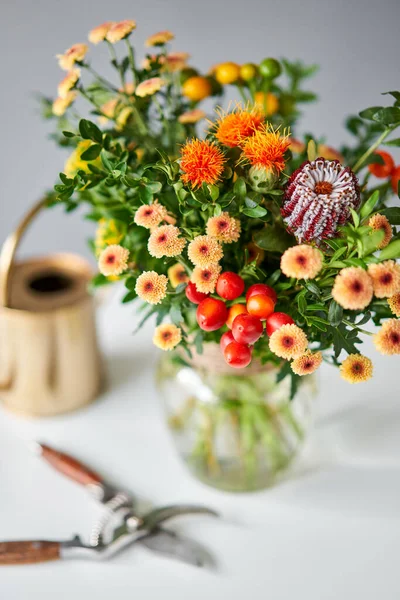 Series, step by step installation of flowers in a vase. Flowers bunch ...