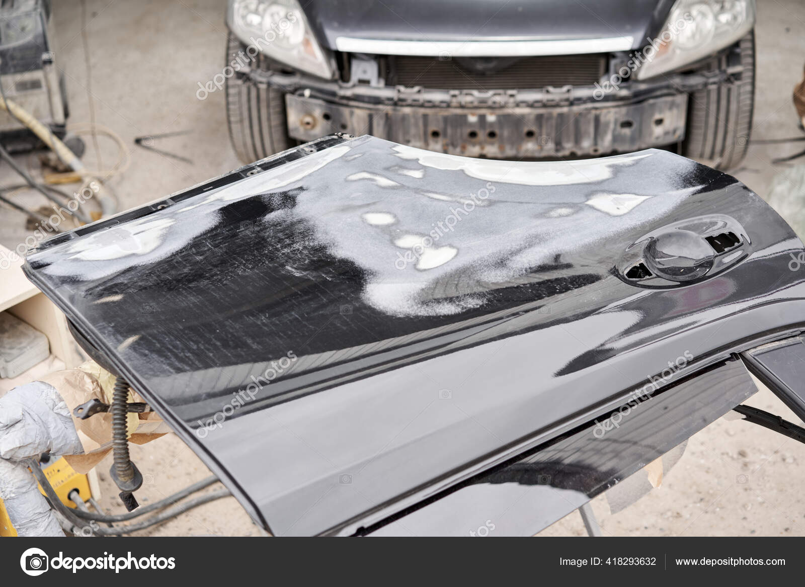 Repairing car body, Application putty close up. The mechanic repair the ...