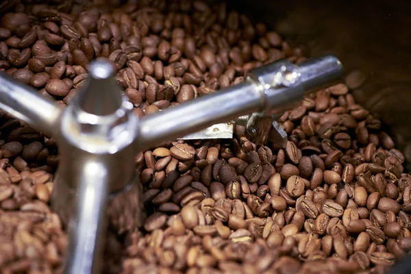 Coffee beans roasted in roasting machine — Stock Photo © mavoimages ...