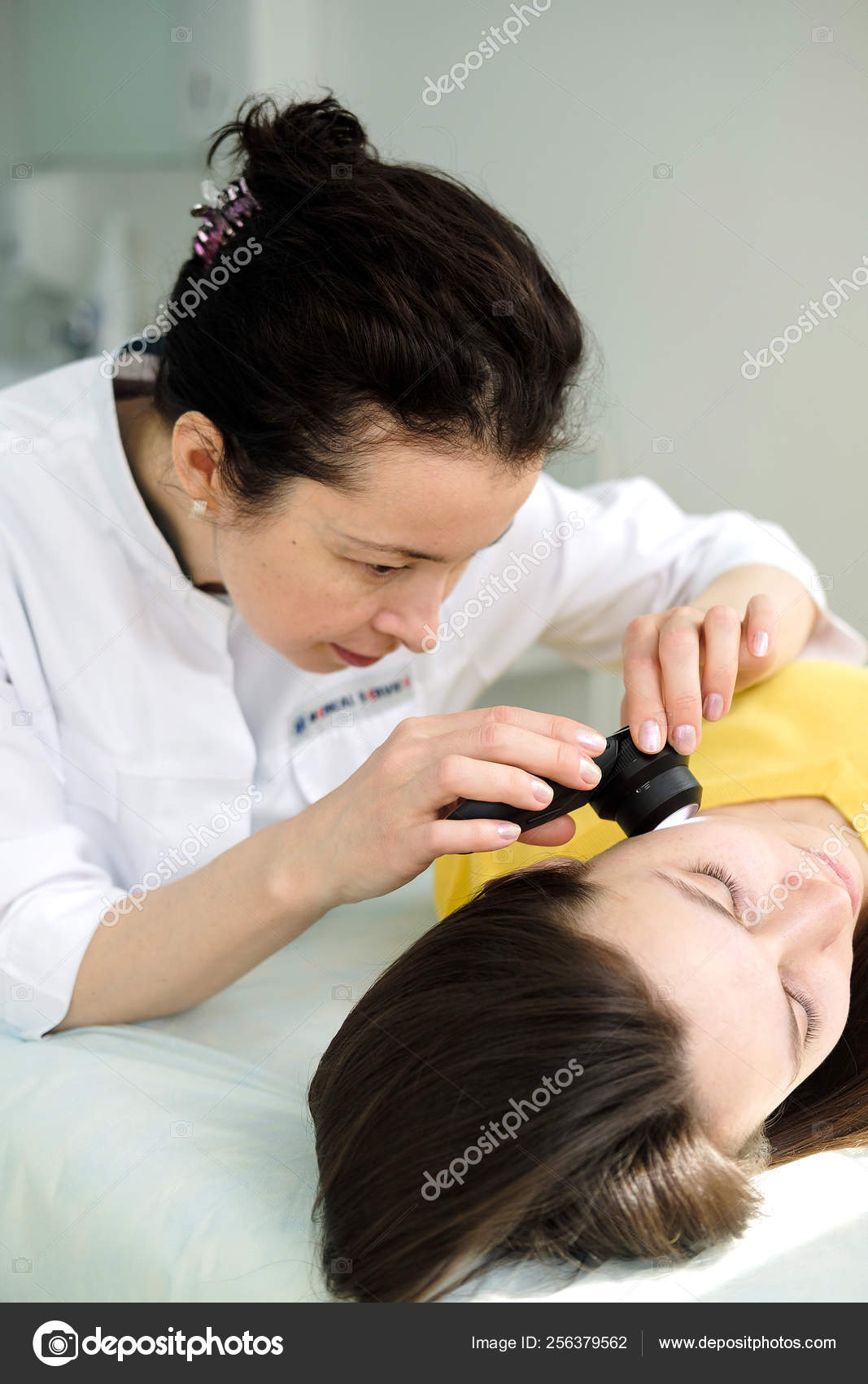 Female Dermatologist Using Professional Dermatoscope While Doing Skin ...